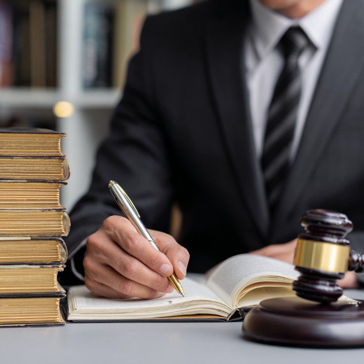 Close-Up Judge’s Gavel with Blue Tint in Courtroom Setting - PresentationGO
