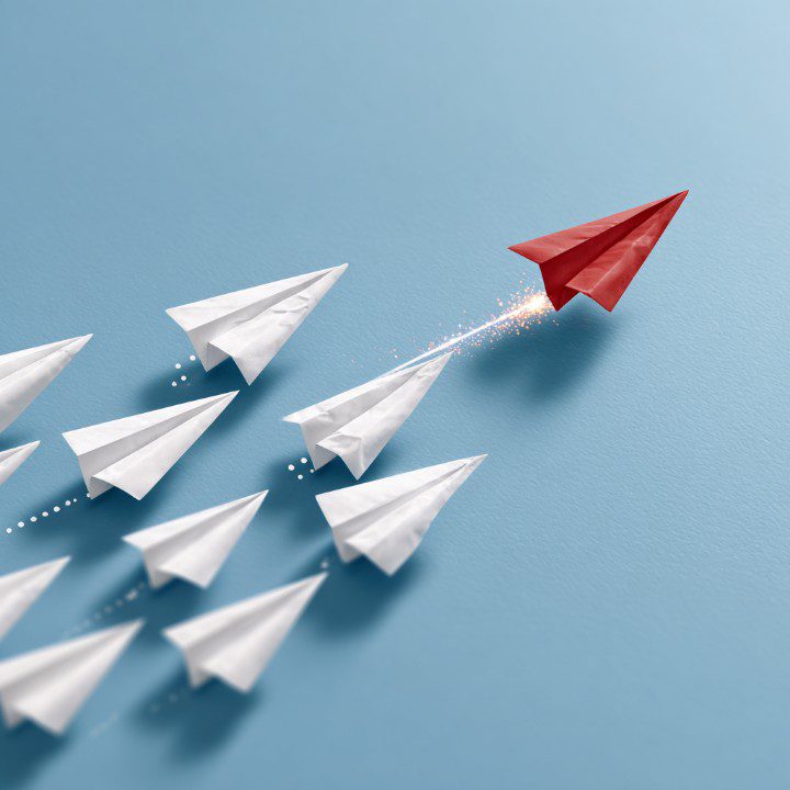 Red Paper Plane Leading the Way: Leadership & Innovation Concept